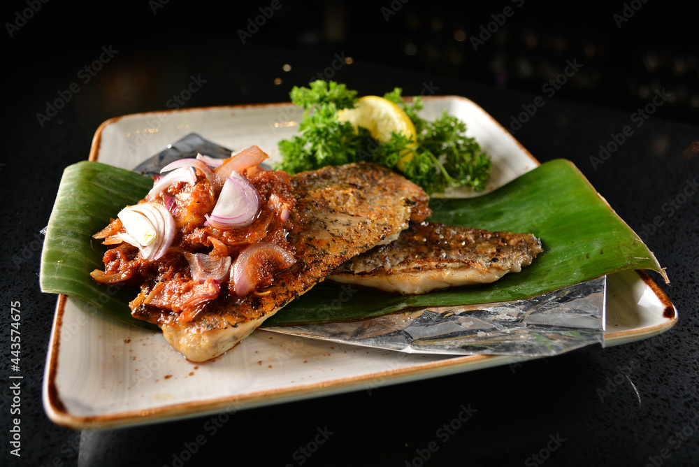 grilled grouper fish fillet with spicy onion sambal chilli sauce on ...