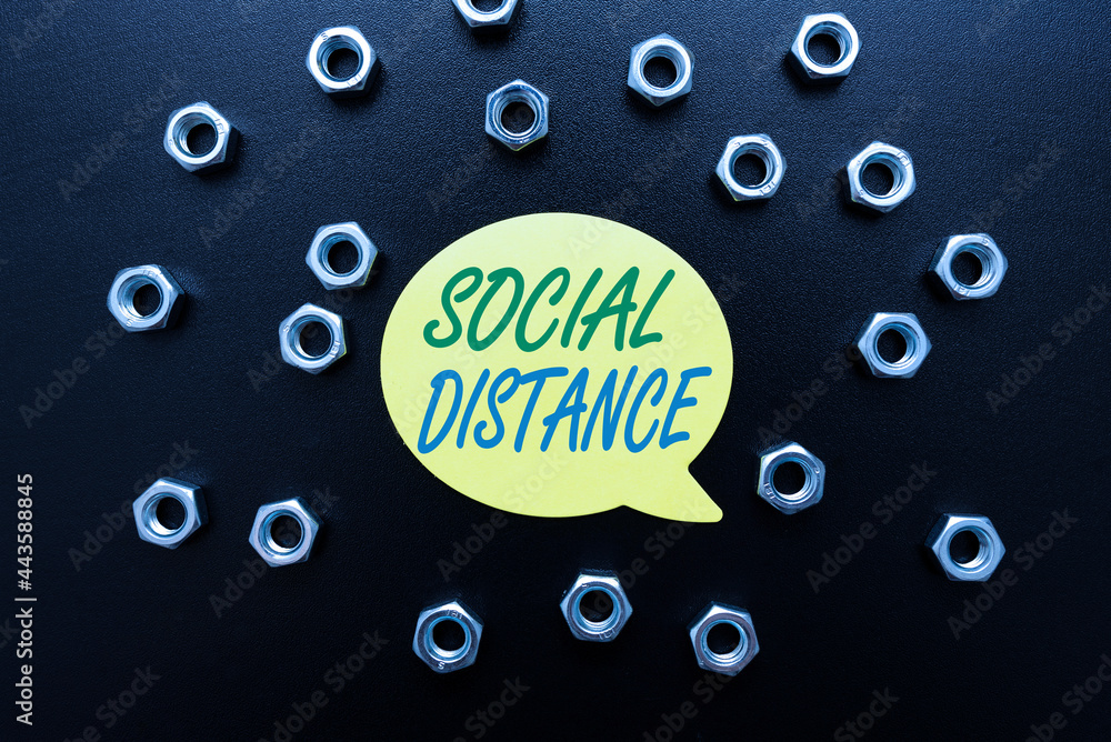 Hand writing sign Social Distance. Word Written on maintaining a high ...