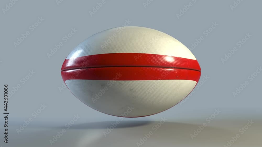 Side profile of 3D Ruby ball spinning in a perfect loop. White rugby ...