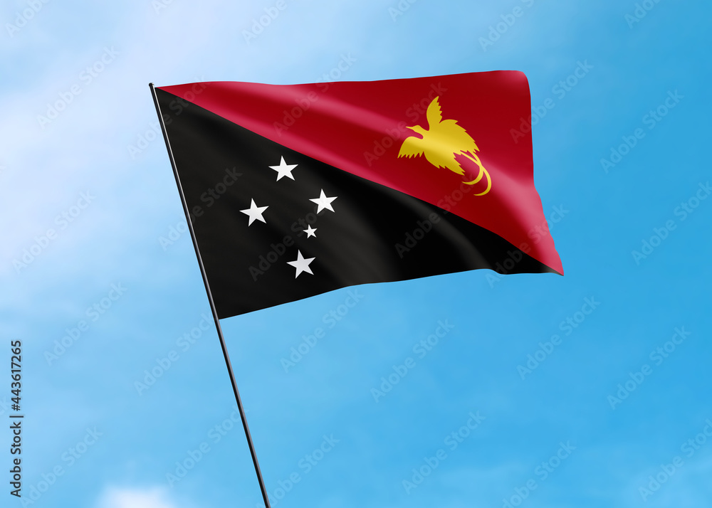 Papua New Guinea flag flying high in the sky Papua New Guinea ...