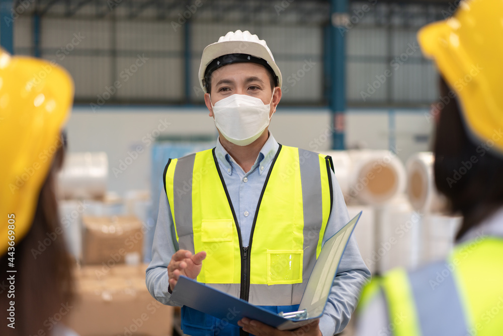 Asian male supervisor engineer in wearing helmet safety and hygienic ...