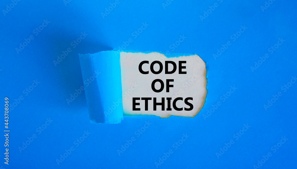 Code of ethics symbol. Words 'Code of ethics' appearing behind torn ...