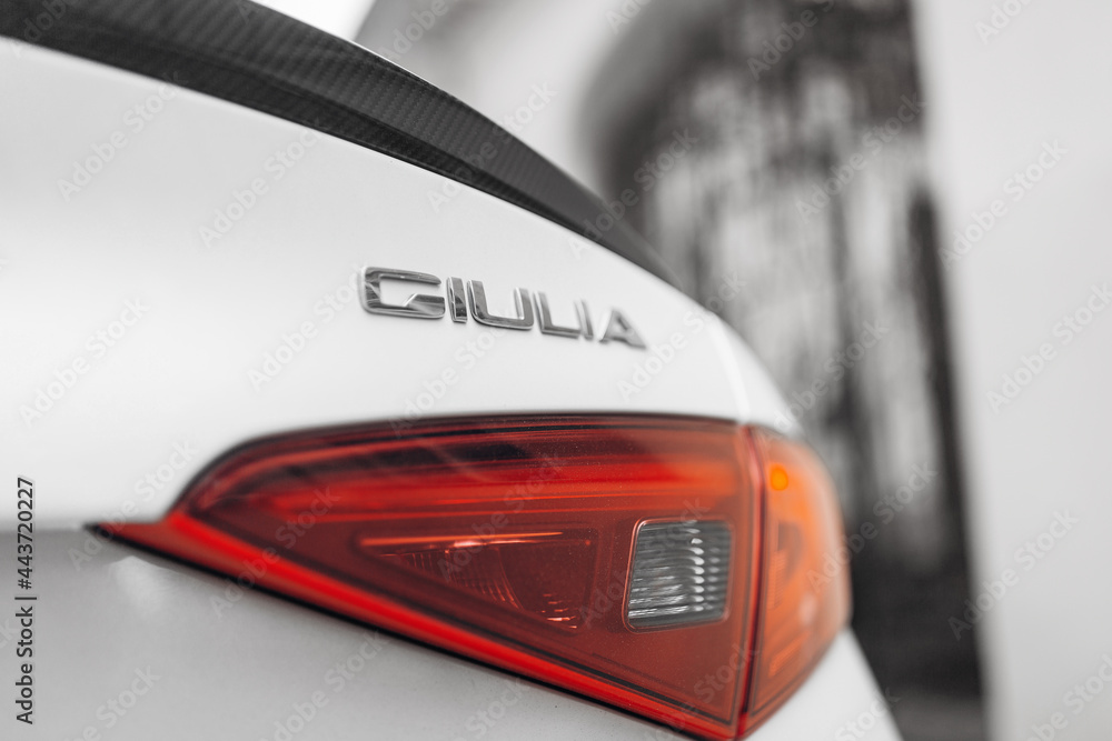 Alfa Romeo Giulia Quadrifoglio logo at the trunk of car Stock Photo ...