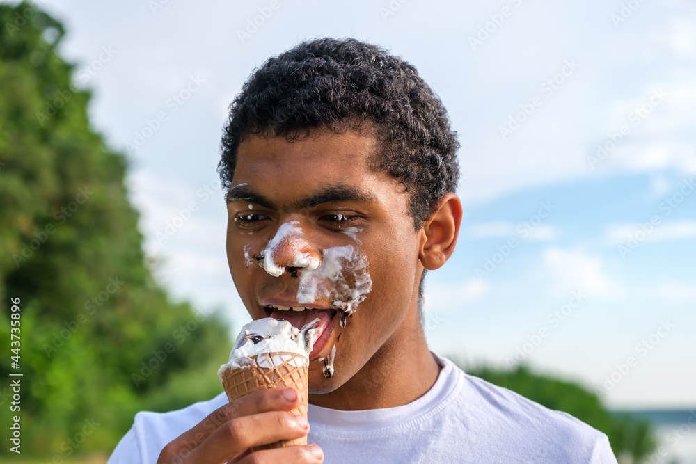 Foto de Man with melted ice cream on his face outdoors in summer do ...