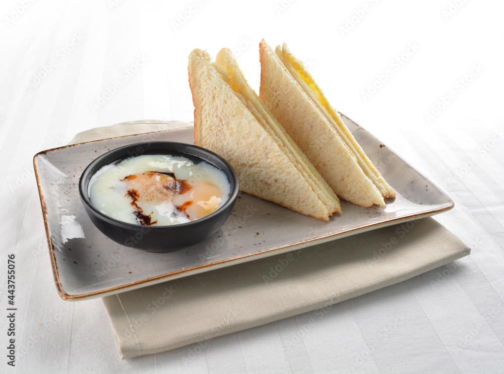 French toast bread roti in kaya and butter jam with half boiled egg in ...