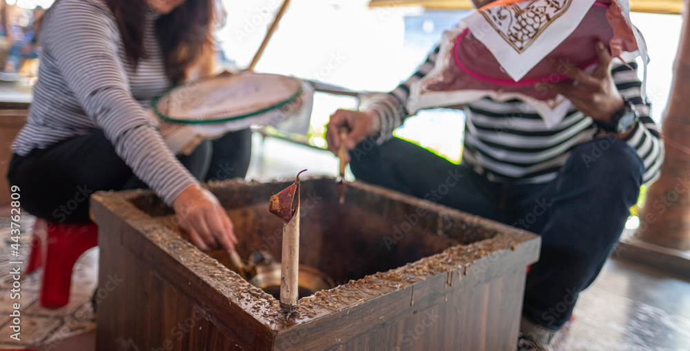 Canting is a pen-like tool used to apply liquid hot wax in the batik ...