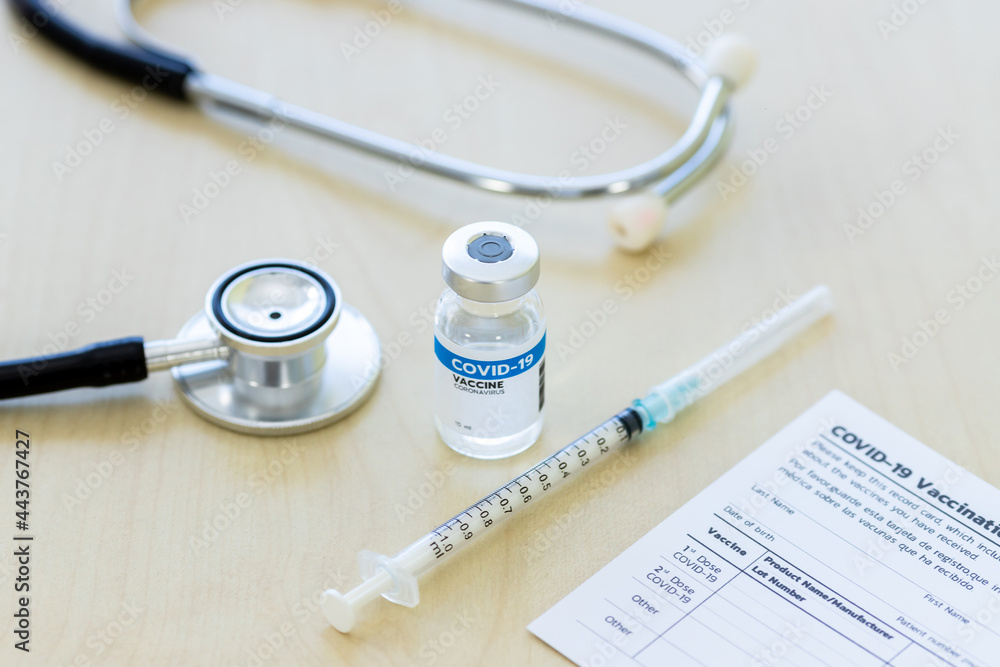 Vaccination concept and medicine: syringe with coronavirus vaccine and ...