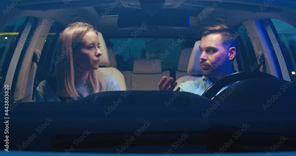 Family traveling by car. Nervous man looking at his road and holding ...