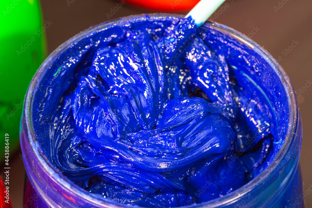 the blue paint in the glass bucket.the blue of plastisol ink for print ...
