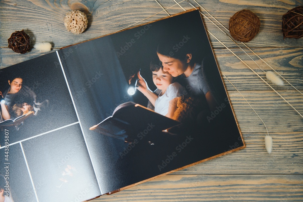 Luxury wooden photo book on natural background. Family memories ...