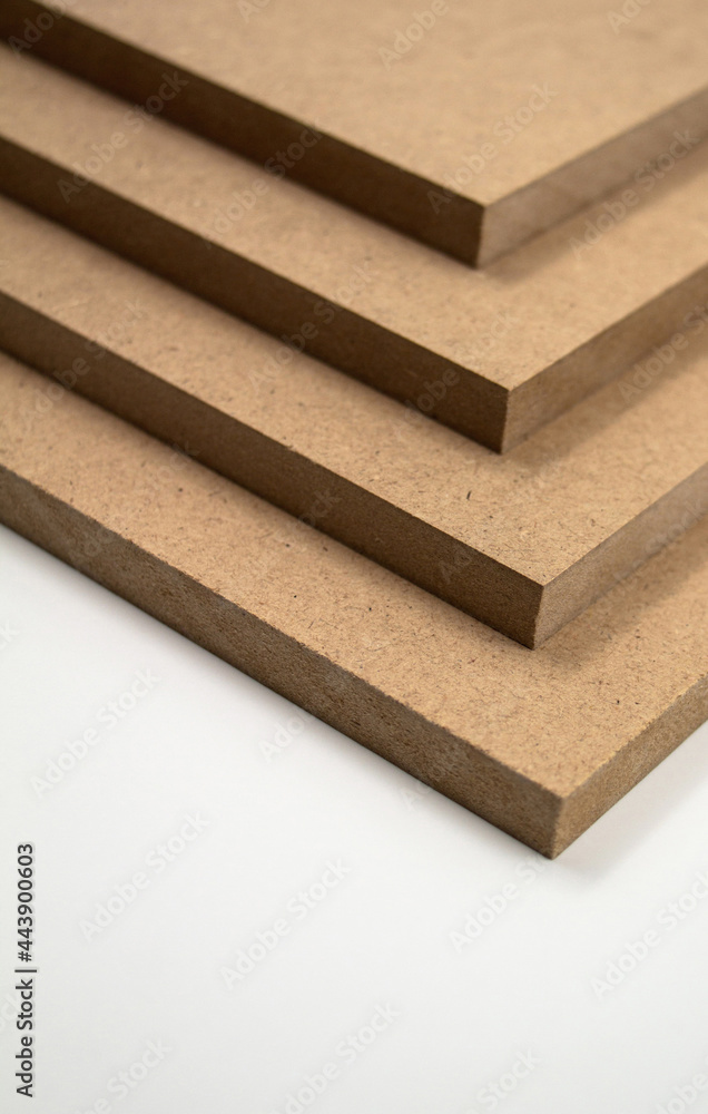 Four plates of raw brown MDF on a white background. Raw MDF can be used ...