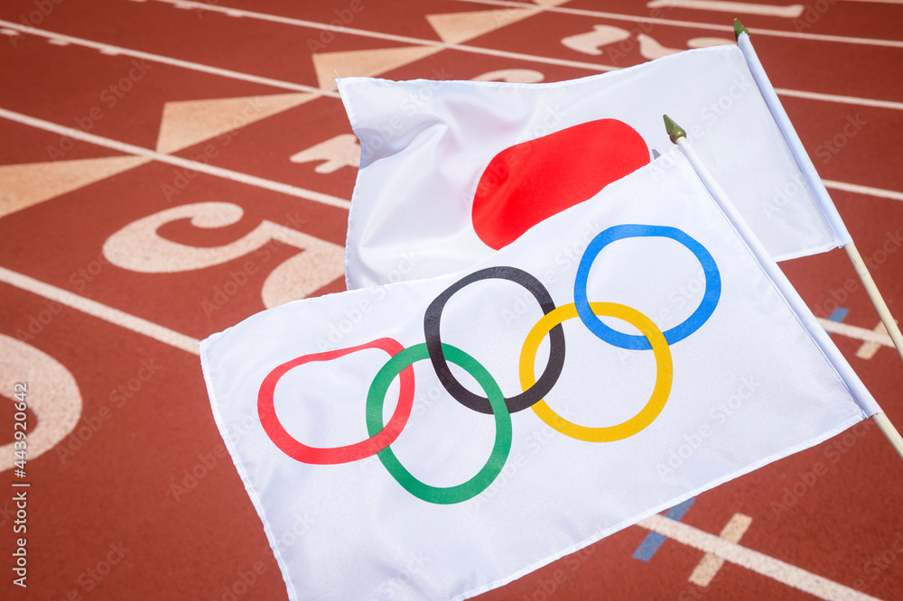 MIAMI, USA - AUGUST, 2019: An Olympic and Japanese flag flutter ...