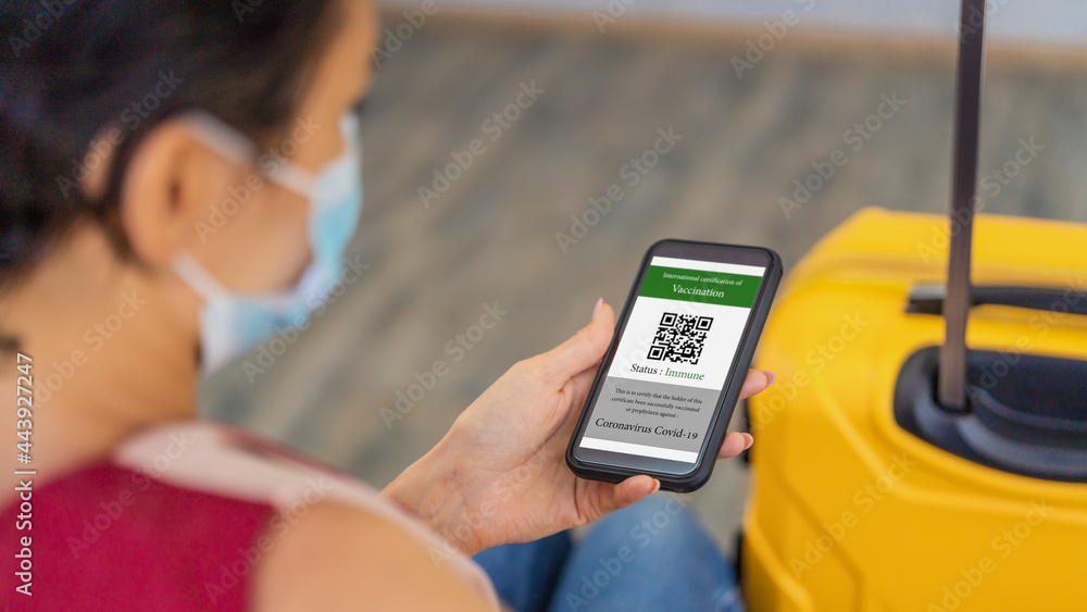 covid-19 vaccination certificate with QR code on smartphone application ...