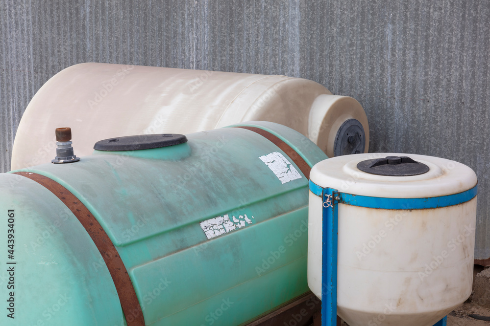 Plastic barrels used for storing agricultural chemical fertilizers ...