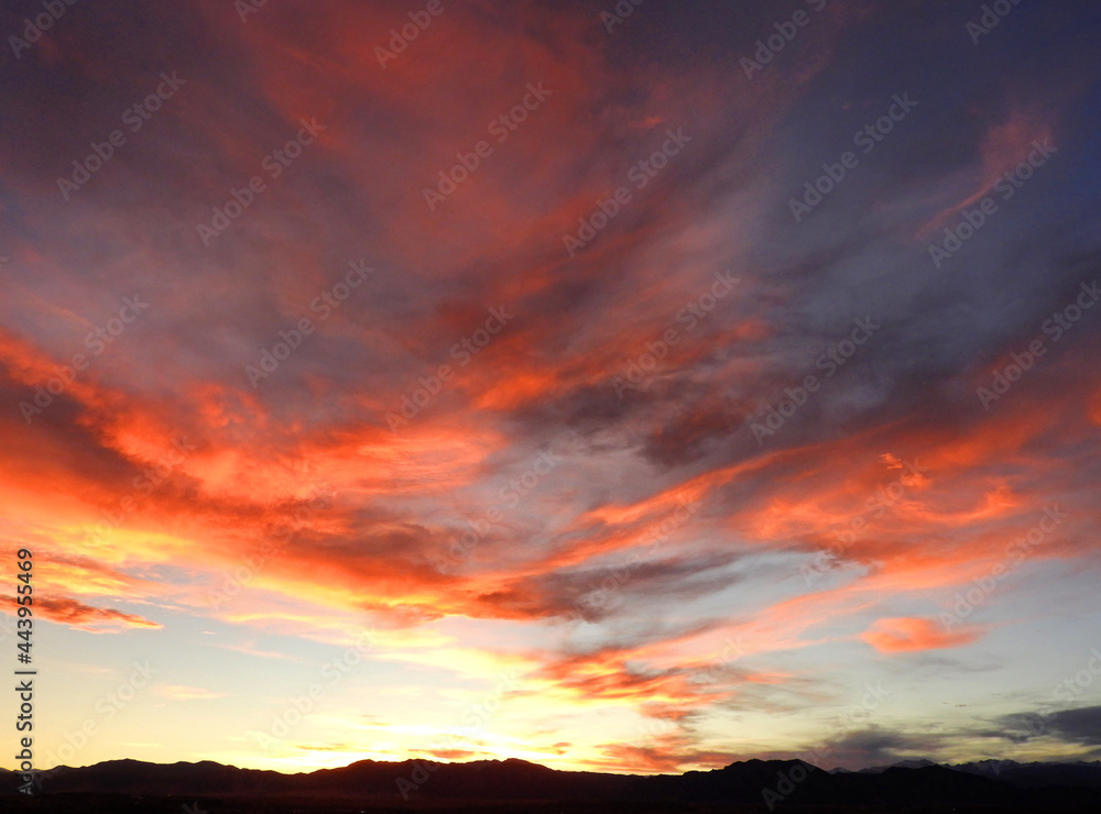 Multi-colored sunset over the front range of the rocky mountains of ...