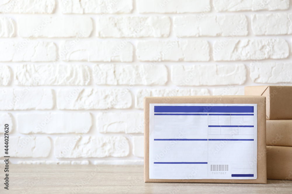 Close up shot of shipping label. Stacked packages of different sizes ...