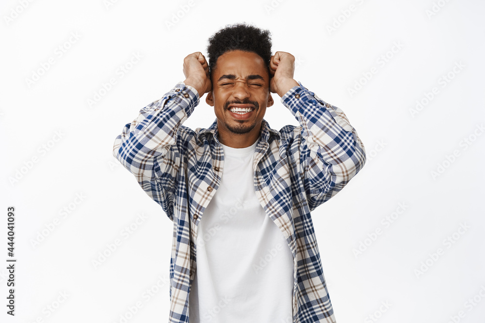 Frustrated african american guy grimacing from failure, shaking hands ...