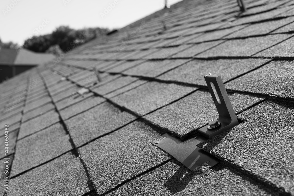 Residential asphalt shingle roof with metal anchors installed for the ...
