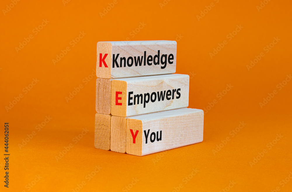 KEY, knowledge empowers you symbol. Wooden blocks with words 'KEY ...
