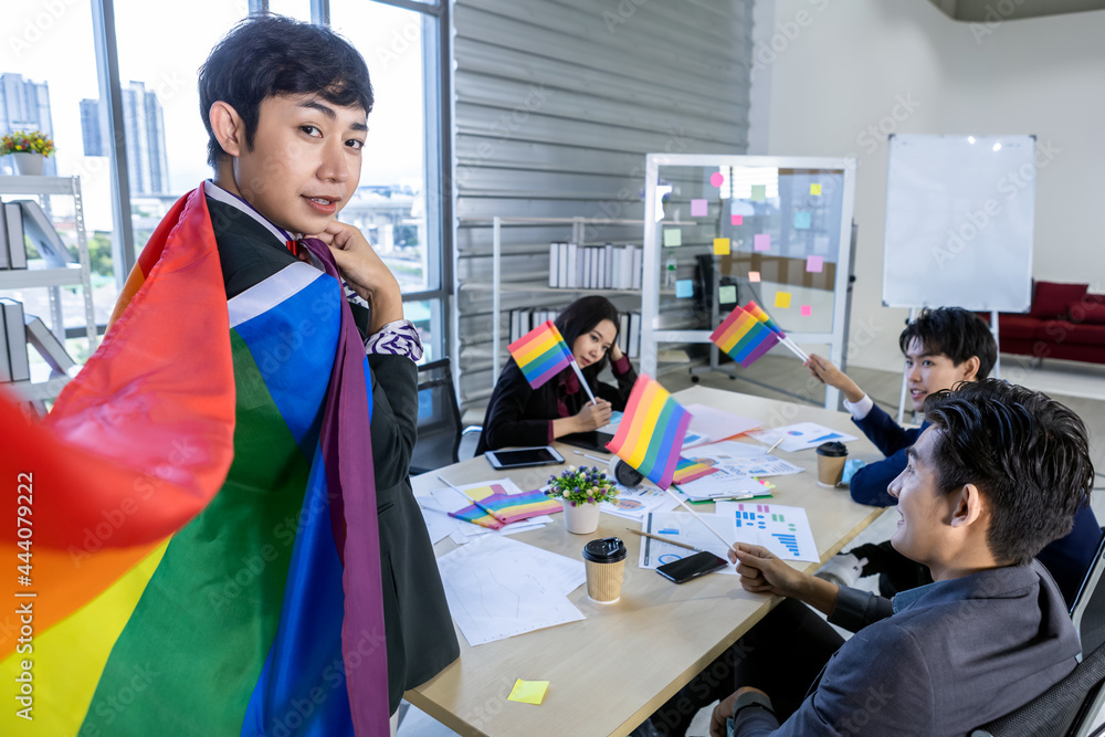 Homosexual Asian businessman with LGBT flag and Successful happy ...