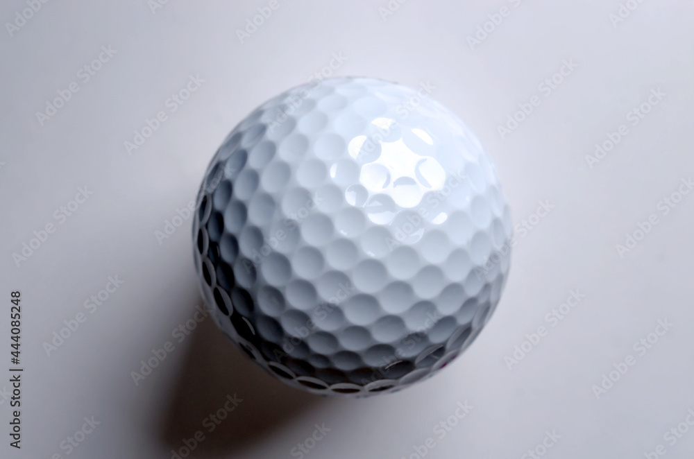 Single white golf ball from above. American golf ball with special ...