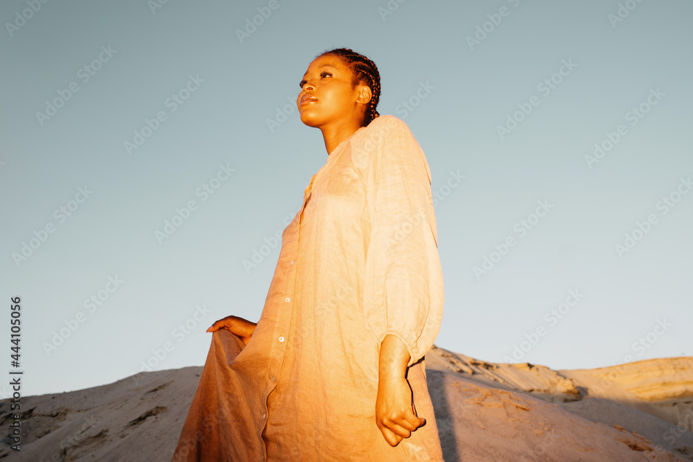 Orange color portrait black woman Stock Photo | Adobe Stock