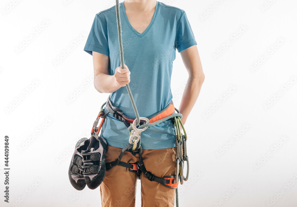 Woman climber belays her partner with the 'Eight' fall arrest system ...
