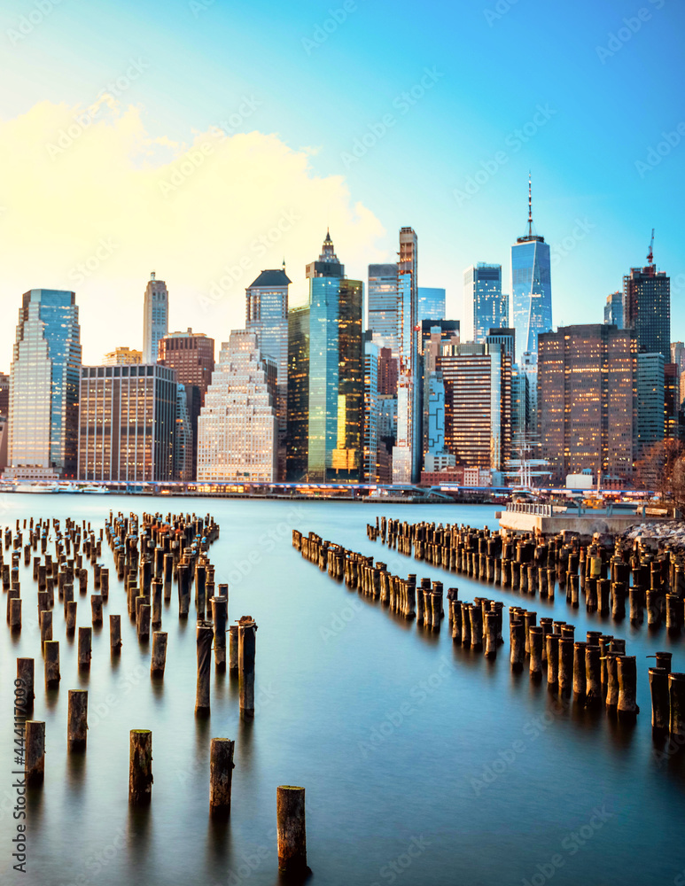 city skyline at sunset sunrise New York usa downtown sky clouds sea ...