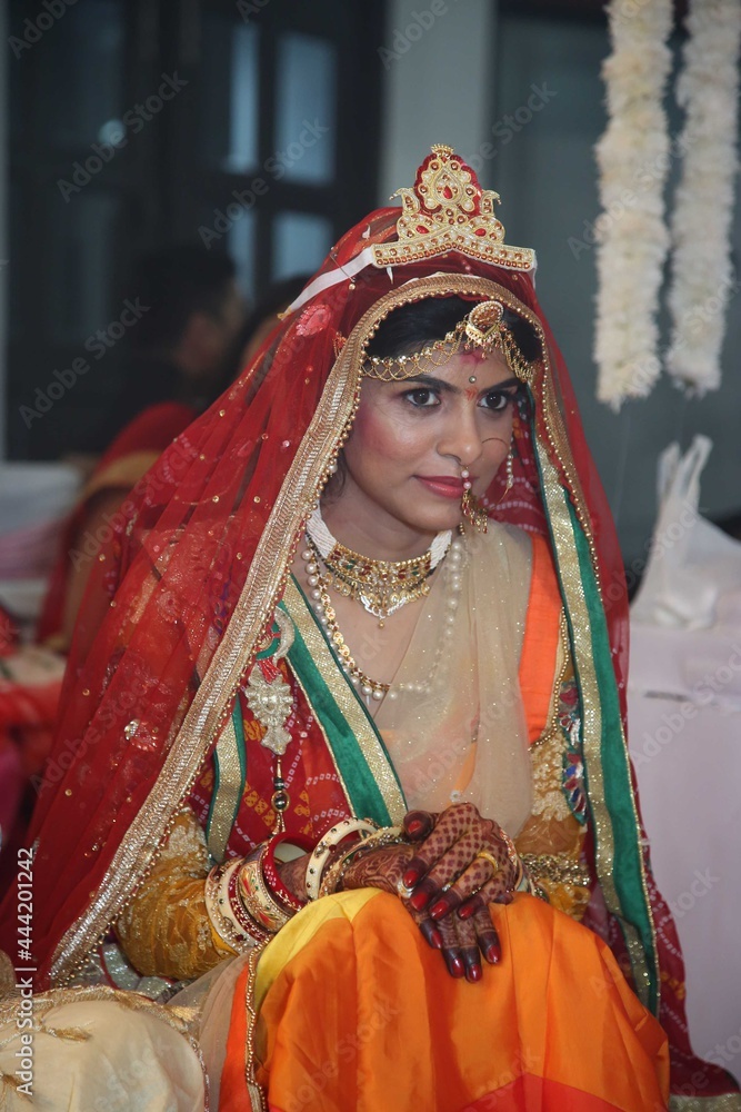 Indian beautiful Bride sitting in marriage pandal with makeup doing ...