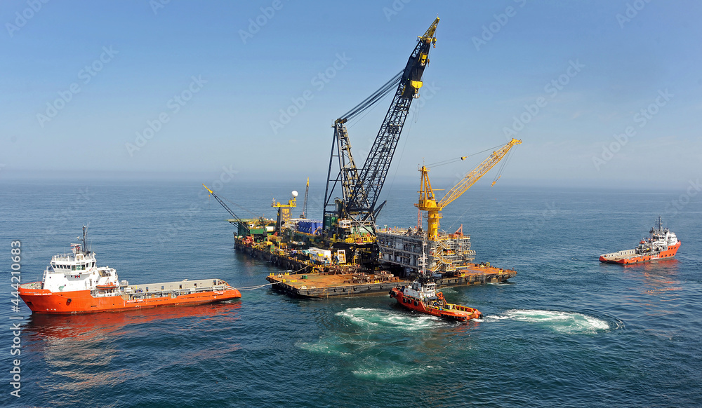 formation of workboats surrounding an offshore construction and ...