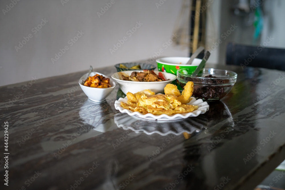 Assorted Malay dishes served on the table. Staple menu for lunch and ...