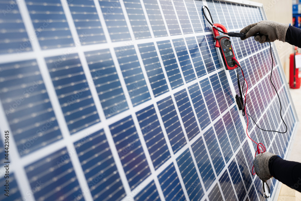 Worker used a meter for checking the readiness of the solar panel to ...