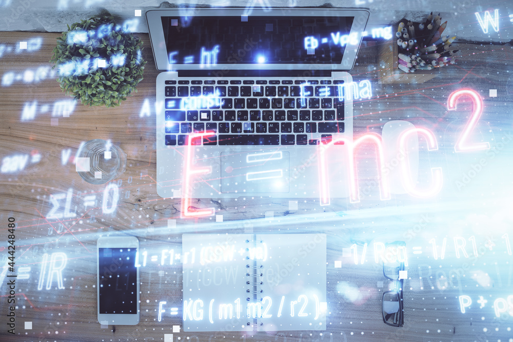 Physics and math theme hologram with formula drawings over computer on ...