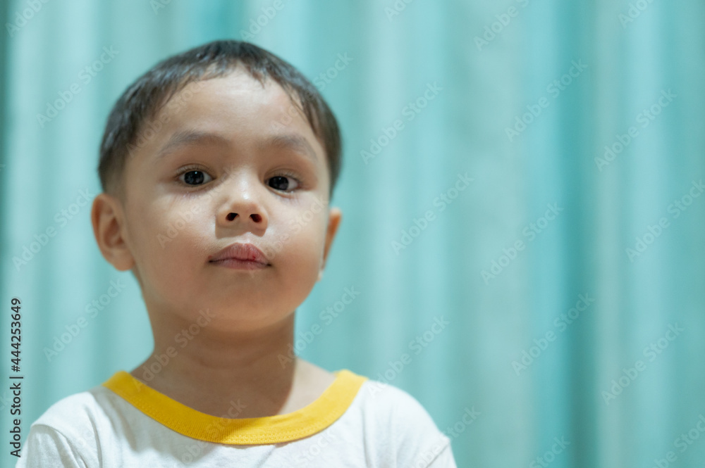 Little cracked cut on boy's lip. Child boy with herpes sore on the lip ...