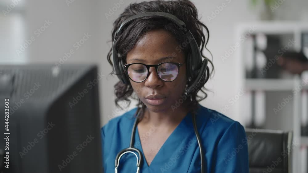 African american black female general practitioner in white coat ...