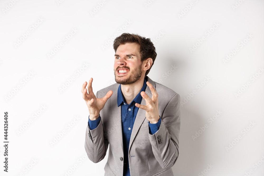 Angry man in business suit look left with hatred, stare aside and ...