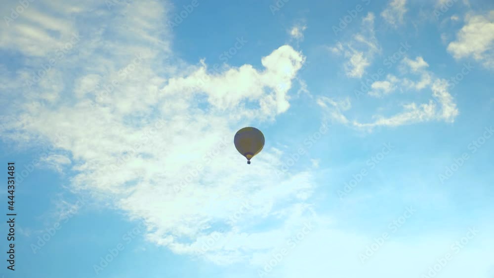 The balloon is flying far away against the background of the sky. The ...