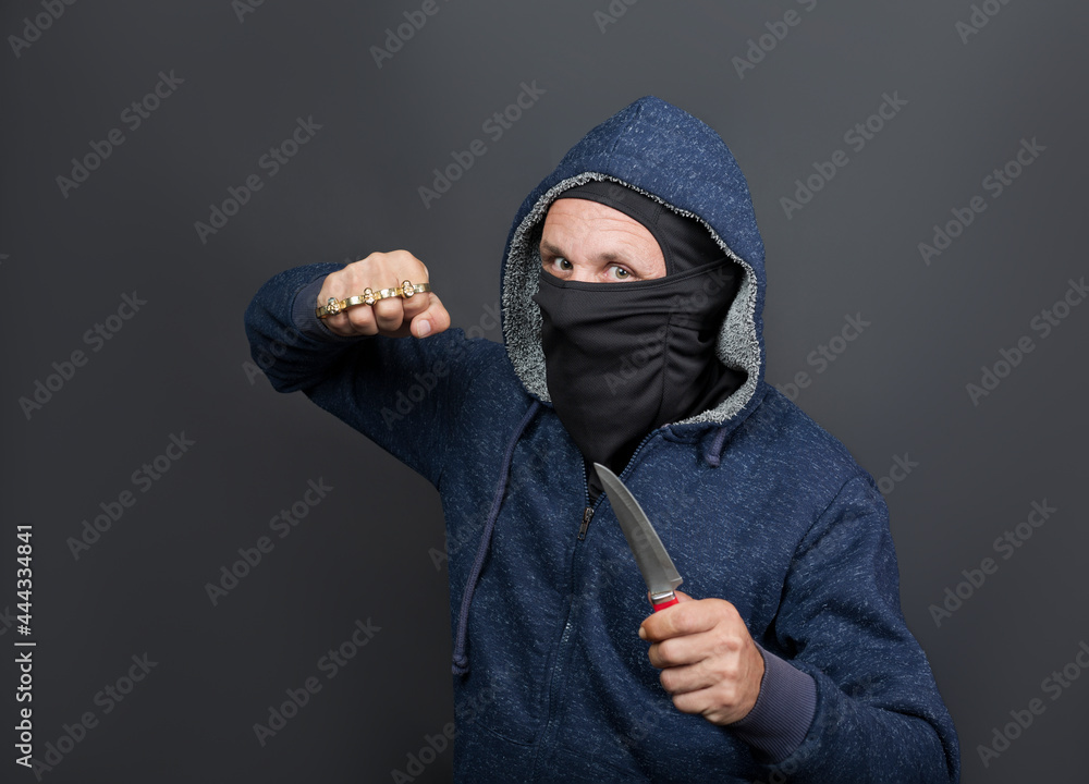 an offender attack with Brass knuckles and knife. Metal brass knuckles ...