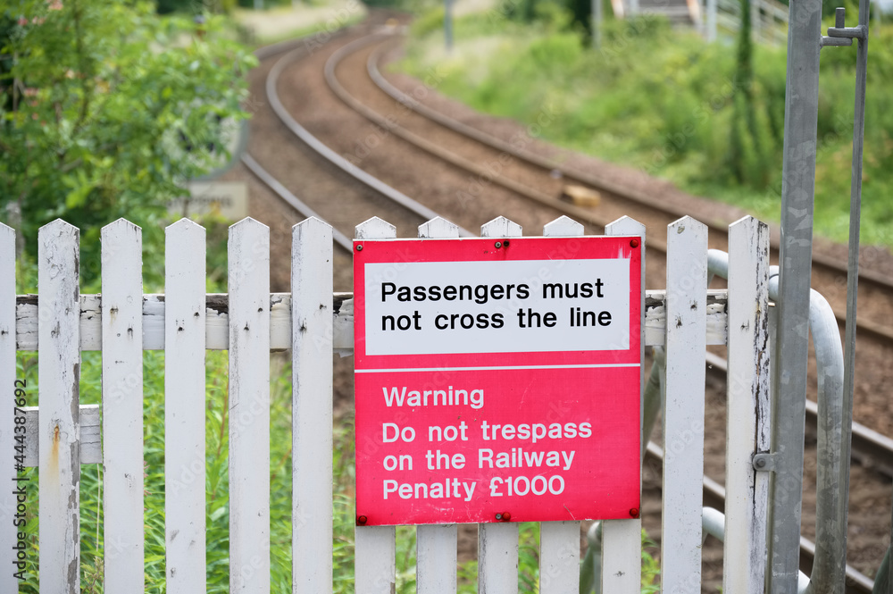 Stop look listen safety road sign at railway train station danger ...