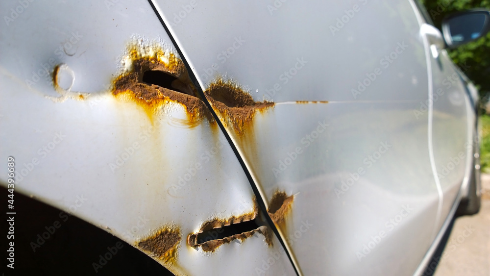 Sheet metal corrosion of white car body. Rusty messy surface. Damaged ...