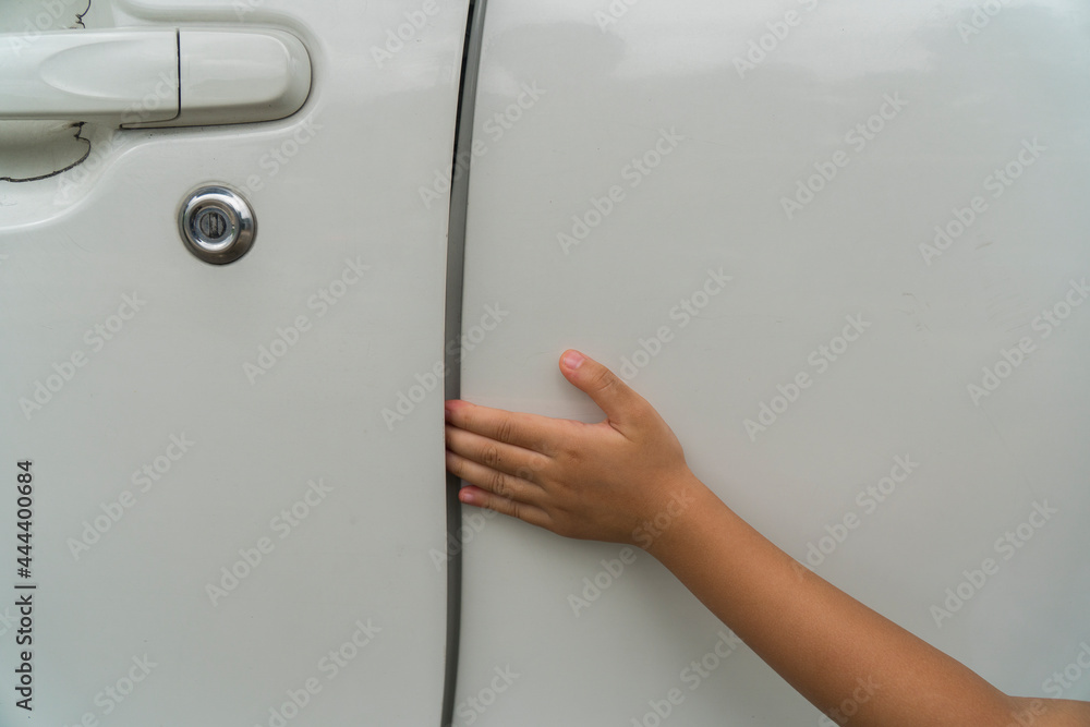 kid hand or finger pinched by the car door; close up portrait of finger ...