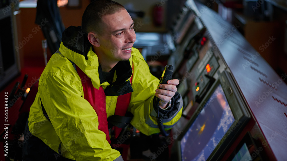 Navigator. pilot, captain as pat of ship crew performing daily duties ...