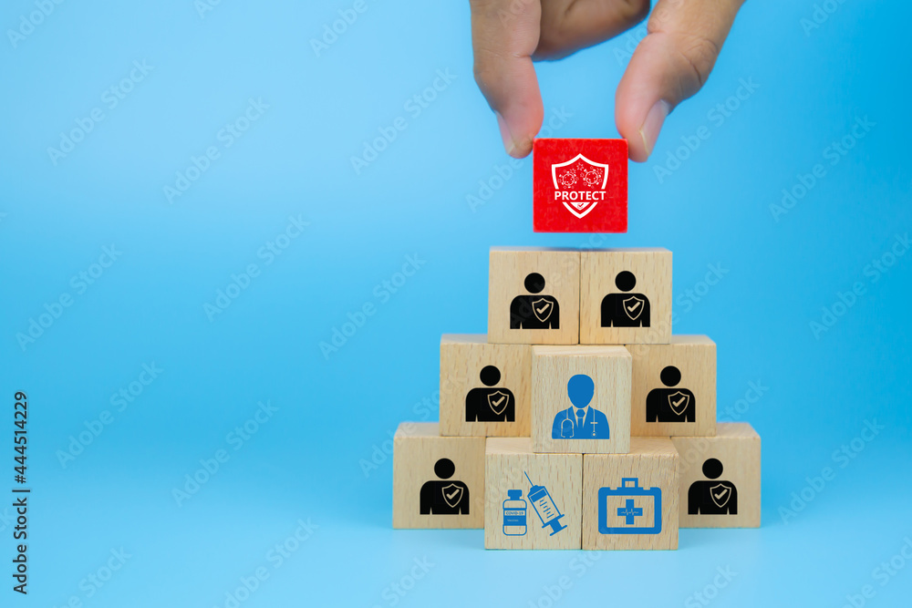 Hand choose covid-19 virus protection on cube wooden block stack in ...