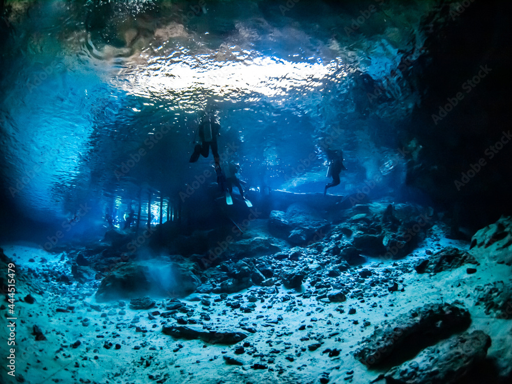 Scuba diving in an underwater limestone cave (Cenote Dos Ojos, Tulum ...