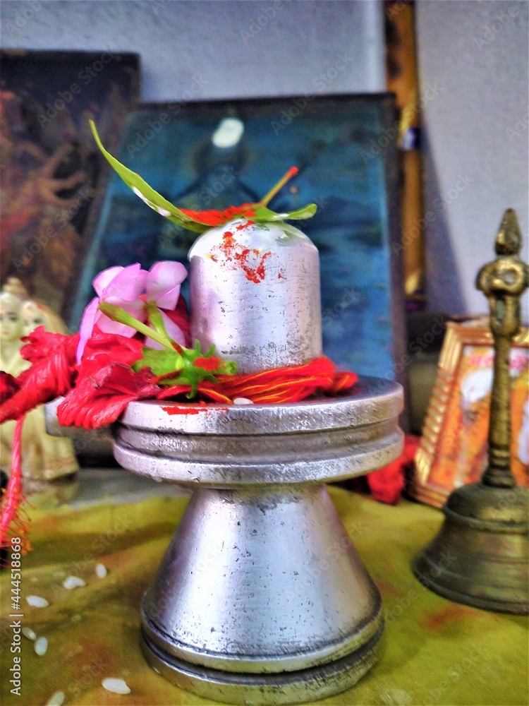 Flowers offered to Hindu Lord Shiva in the form of Shivling Stock Photo ...