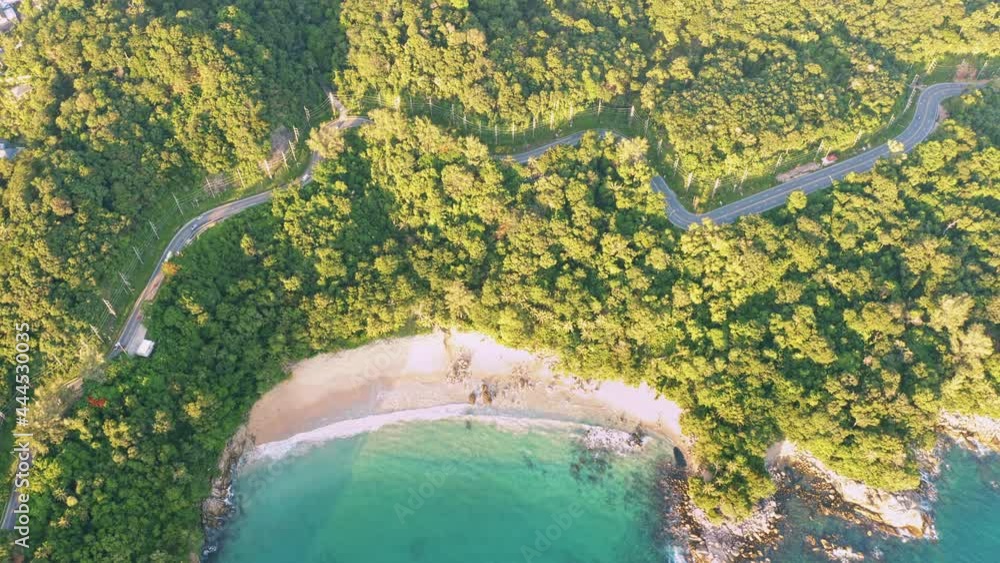 4K Areal drone top down view of curves of coastal road Phuket Thailand ...