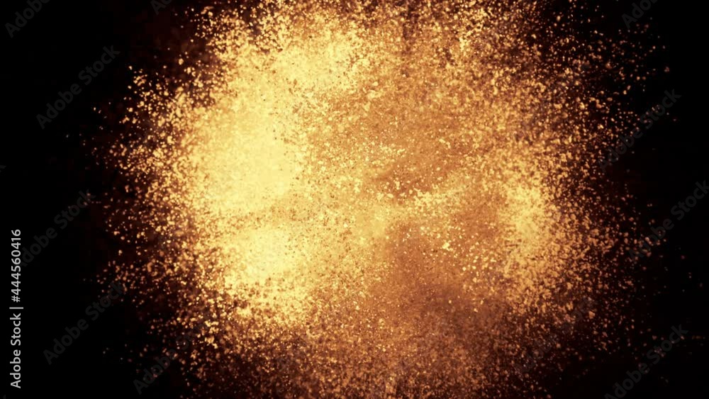 Animation of an explosion of golden yellow particles on a black ...