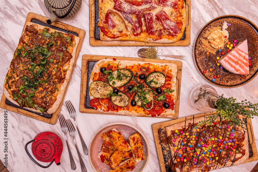 Sweet and savory rectangular pizzas. Pizza with serrano ham and cheese ...