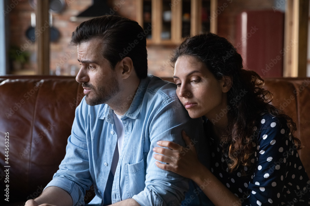 Wife expressing empathy and compassion to sad frustrated husband, going ...