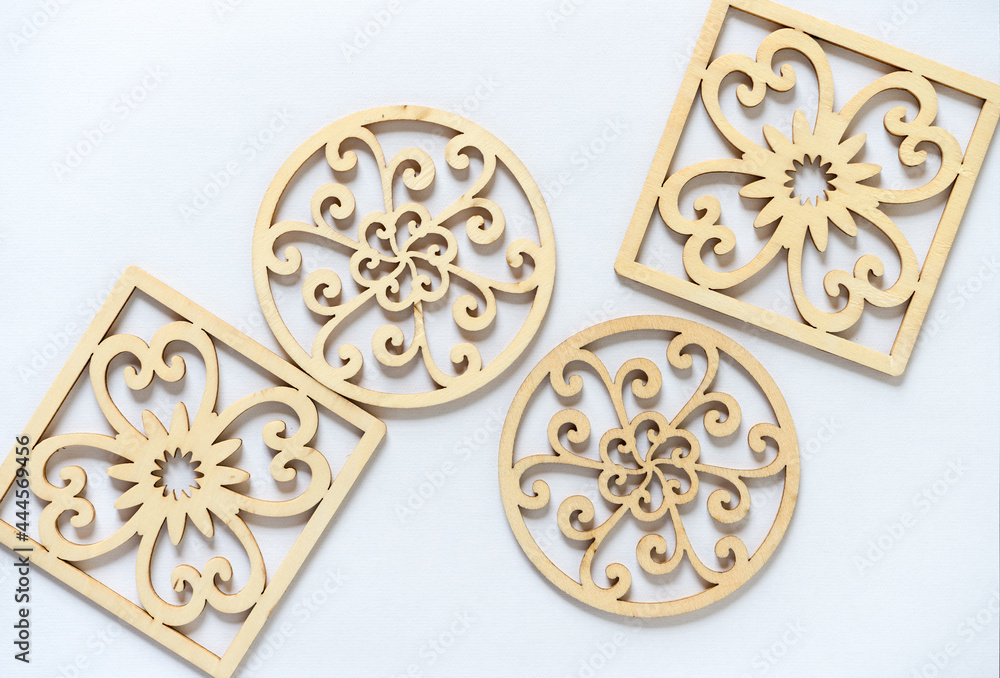 fancy laser cut wooden circles and squares on a light background Stock ...